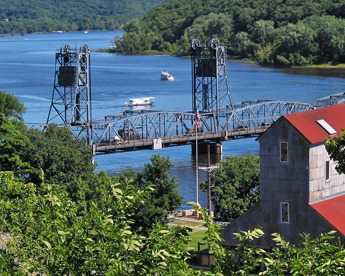 The St. Croix River flows past Stillwater with the casual confidence of a supermodel on a runway, boats dotting its surface like accessories completing the perfect outfit.