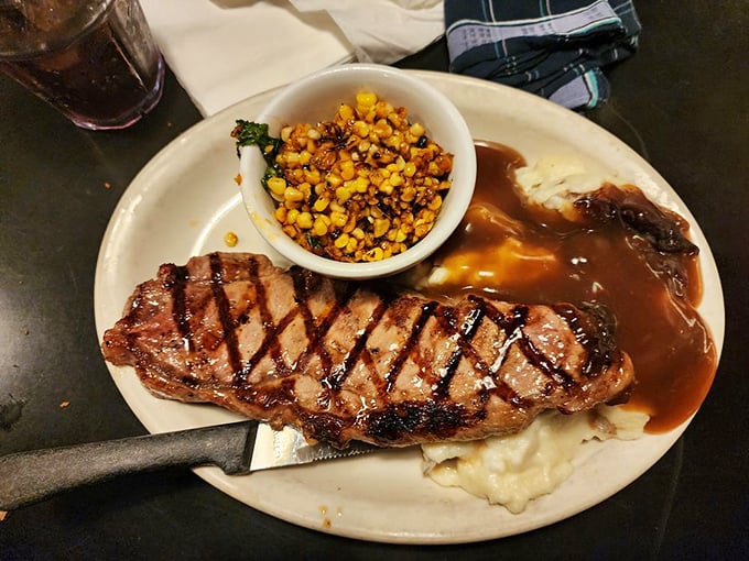 This steak isn't just cooked—it's been loved. Paired with mashed potatoes and gravy that could make a vegetarian question their life choices.