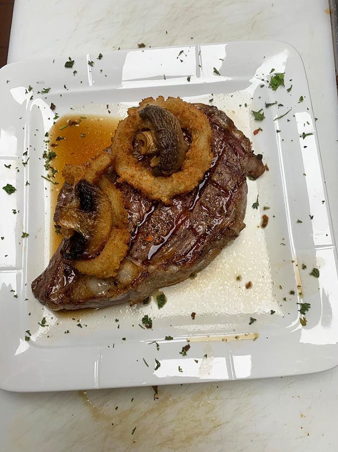 A steak that's dressed for success with those crispy onion rings—like a power suit for your plate.