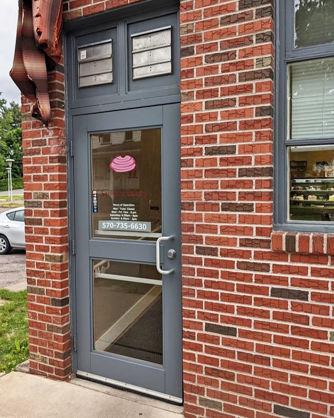 The entrance may be modest, but that pink cupcake decal on the door is like a secret handshake—you're about to enter somewhere special.