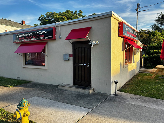 Supreme's Place might not win architectural awards, but those red awnings signal the kind of neighborhood spot where regulars have "the usual."
