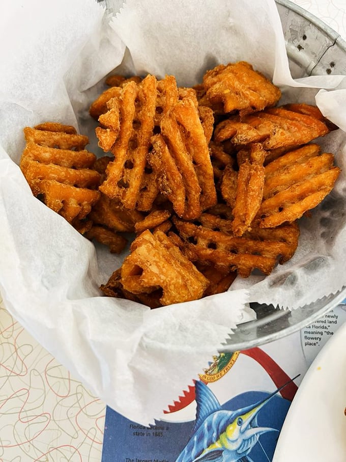 Sweet potato waffle fries – the rebellious cousins of regular fries who went to art school and came back with better fashion sense and flavor.