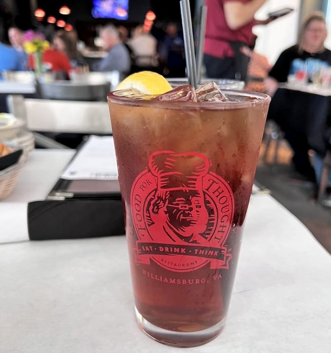 Even the drinks get the thoughtful treatment – a refreshing iced tea served in a glass that proudly displays the restaurant's philosophical mission.