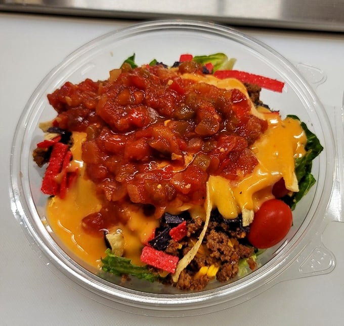A taco salad that refuses to be boring – layers of flavor in a crunchy edible bowl that makes eating vegetables feel like cheating.