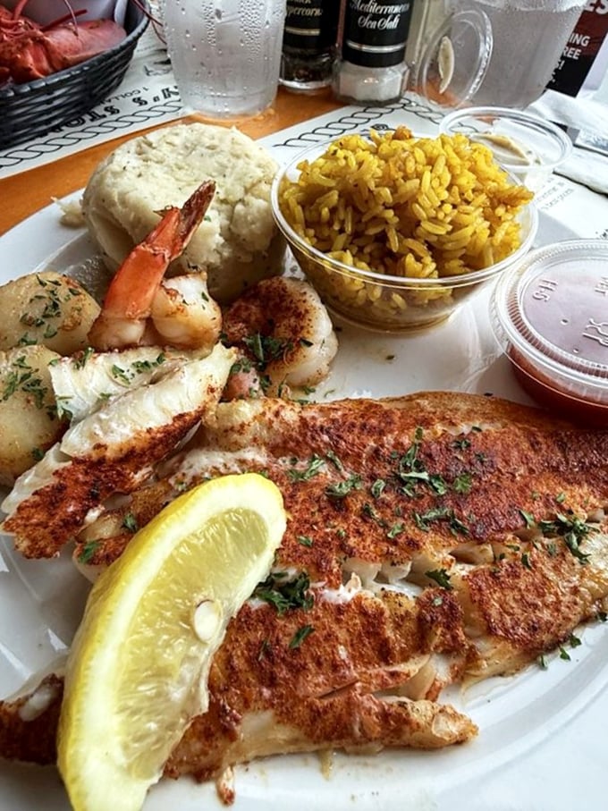 A seafood platter that's basically Florida's greatest hits album – blackened fish, plump shrimp, and sides that don't know they're supporting actors.