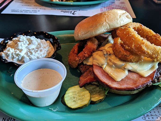 This isn't just a sandwich – it's an engineering marvel with onion rings that deserve their own architectural award.