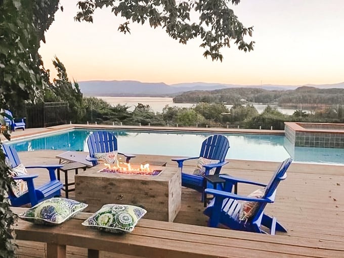 Blue Adirondack chairs, a fire pit, and that view – proof that sometimes the best entertainment doesn't require a subscription or Wi-Fi password.
