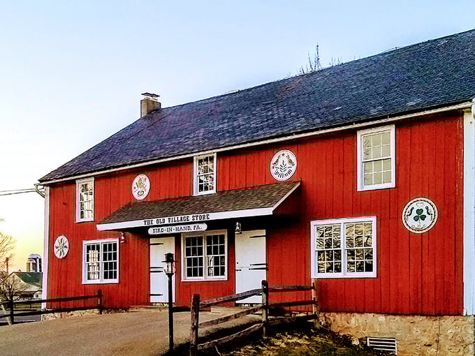 The Old Village Store glows red against the countryside like a Norman Rockwell painting come to life—minus the Instagram filter.