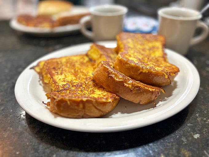 French toast that makes ordinary bread realize its full potential. Crisp edges, custardy center—breakfast nirvana achieved.