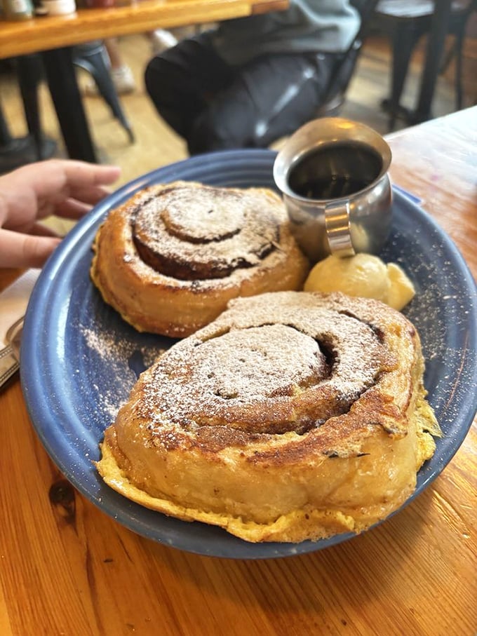 Those cinnamon rolls aren't just breakfast, they're an event – dusted with powdered sugar and served with a side of mountain morning bliss.