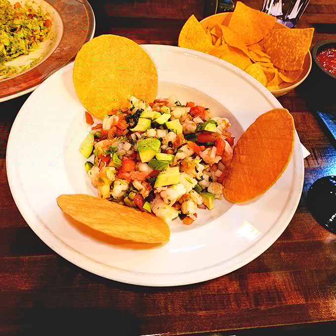 Bright, fresh ceviche with crispy tostadas standing guard like tiny edible soldiers ready for duty and dipping.