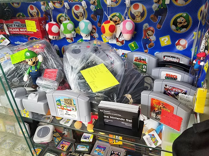 Nintendo cartridges and Mario memorabilia prove one generation's toys become another's collectibles. The mushroom kingdom lives on in this glass case.