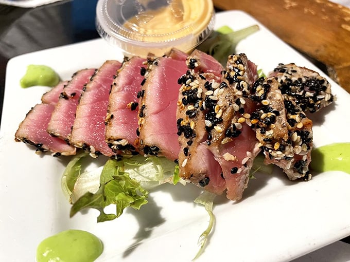 Sesame-crusted tuna that's perfectly rare inside—like finding a unicorn that tastes like the ocean in the best possible way.