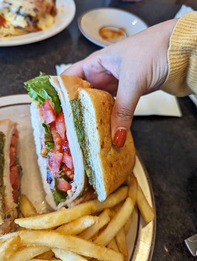 This isn't just a sandwich—it's architecture. Layers of fresh ingredients stacked between bread with the structural integrity to hold it all together.