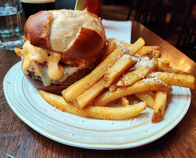 Melted cheese cascading down like a dairy waterfall over a perfectly cooked patty. This isn't just a burger—it's performance art you can eat.