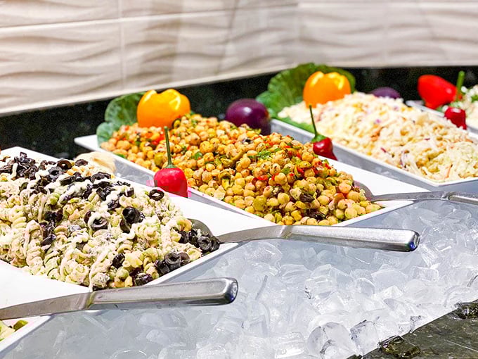 The salad bar at Cafe Mineiro isn't just an afterthought—it's a vibrant, colorful prelude to the meat symphony that follows. Strategy is required.