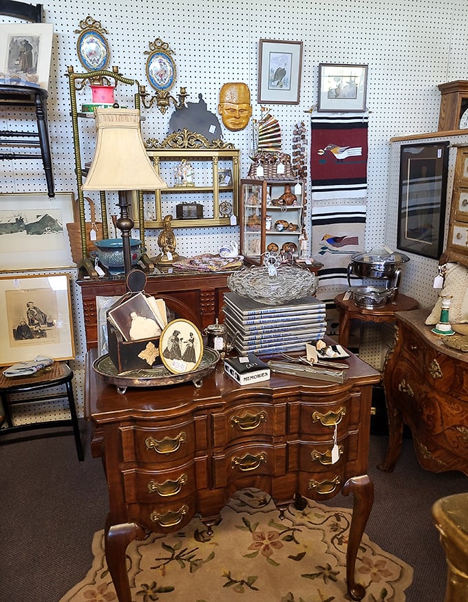 A collector's fever dream of organized chaos—where that perfect French provincial desk plays hard to get among vintage photographs.