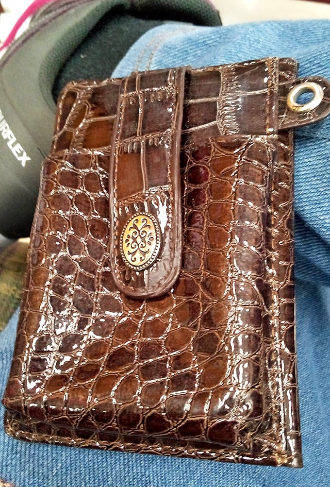 This crocodile-textured wallet once held someone else's secrets and credit cards – now it awaits your Costco membership and coffee punch cards.