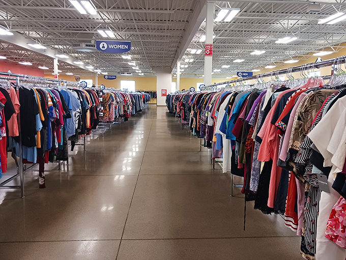 Endless racks of possibility stretch toward the horizon. Each garment holds a story—and potentially your next "Can you believe I found this at Goodwill?" moment.