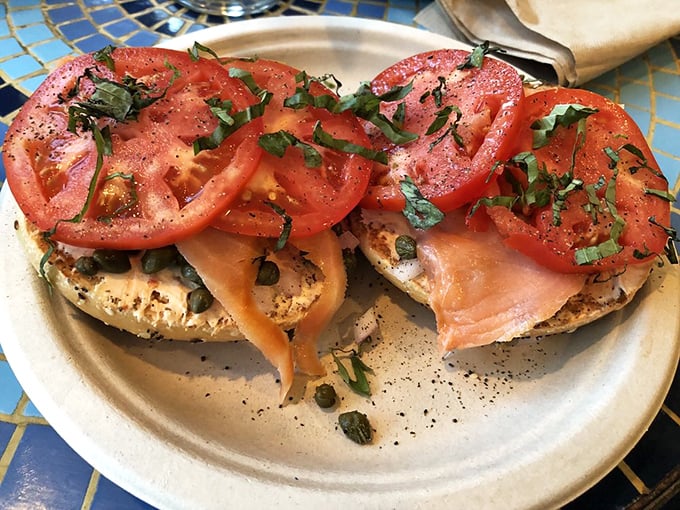 The bagel with lox that would make any New Yorker nod in approval—fresh tomatoes and salmon arranged with the precision of a Renaissance painting.