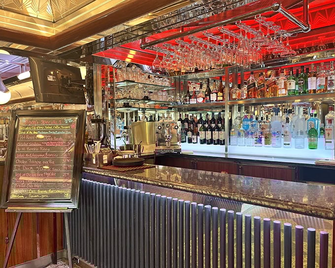 The bar gleams with promise, where breakfast dreams and evening cocktails coexist in chrome-and-glass harmony.