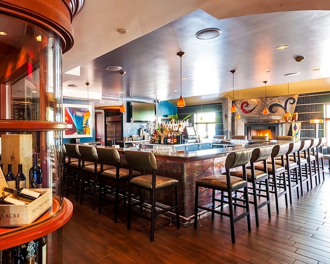 The bar isn't just where drinks are made – it's where strangers become friends and food envy reaches Olympic levels.