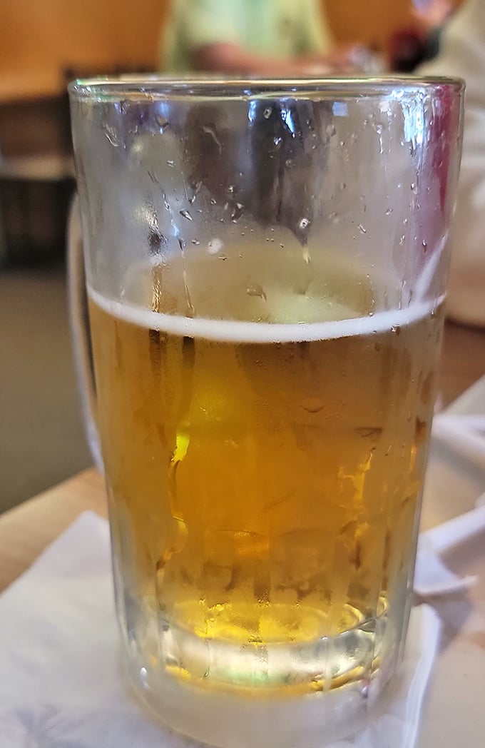 Cold beer in a no-nonsense glass – because sometimes the perfect pizza pairing doesn't need a fancy stem or artisanal backstory.