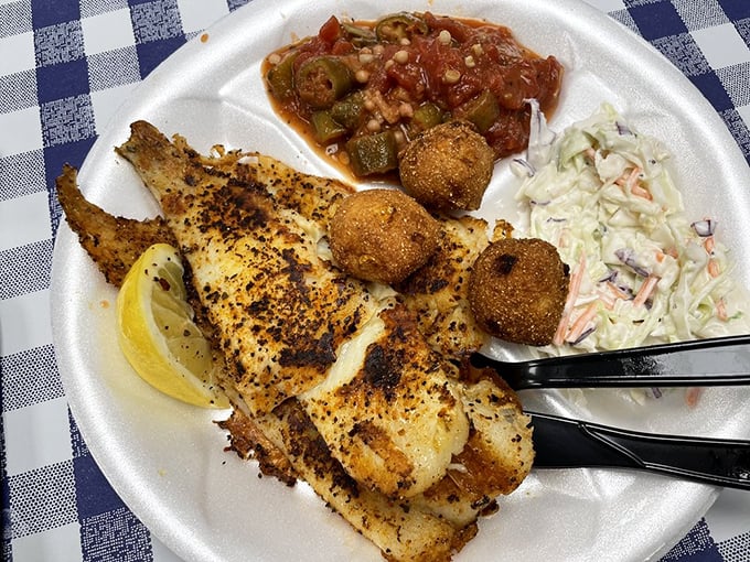 Blackened fish that's not burnt—it's character-building. That lemon wedge isn't garnish; it's the perfect high note in this seafood symphony.