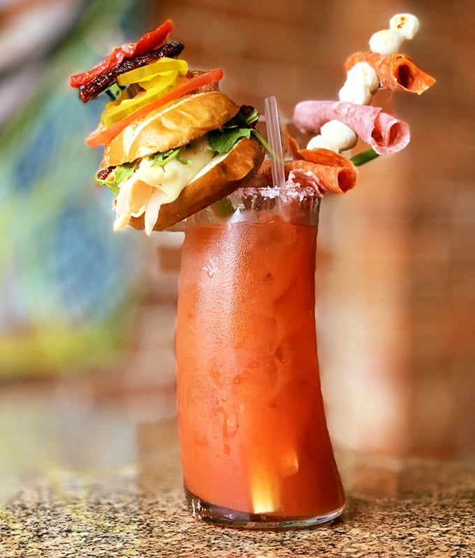 Not just a Bloody Mary, but a portable feast—where your drink comes accessorized with a sandwich hat and meat jewelry that makes brunch infinitely more exciting.