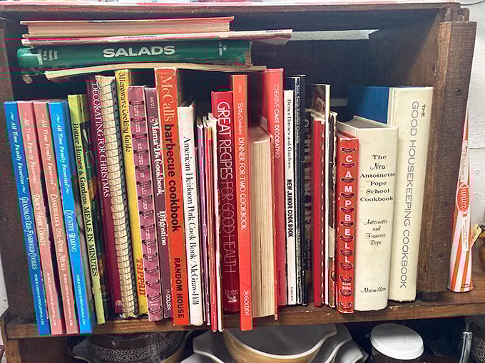 Cookbooks with splattered pages and handwritten notes—each one a time capsule of American eating habits and that casserole everyone pretended to love.