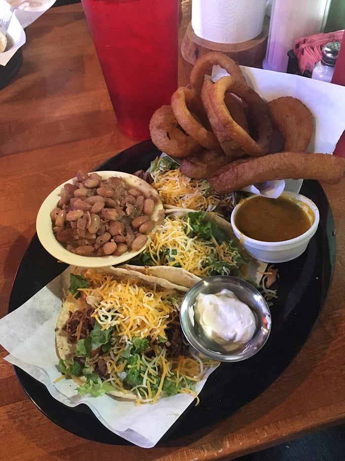 Tacos gone rogue—when barbecue meets Tex-Mex and nobody loses. Those onion rings are the supporting actors who steal the scene.