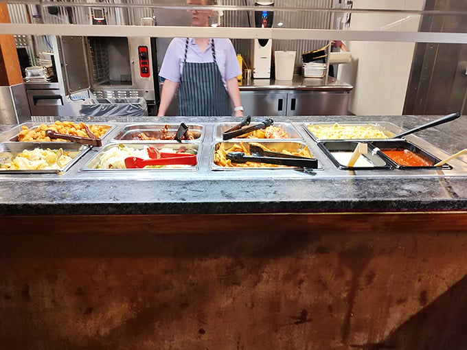 Behind every great buffet is a staff member tending to these treasure troves of flavor—the culinary equivalent of Willy Wonka's chocolate river.