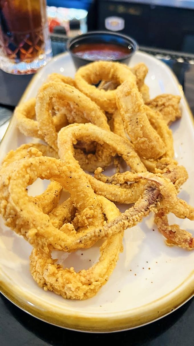 Calamari that doesn't require an Olympic-level jaw workout—tender rings in a crispy coating that would make even squid-skeptics reconsider.