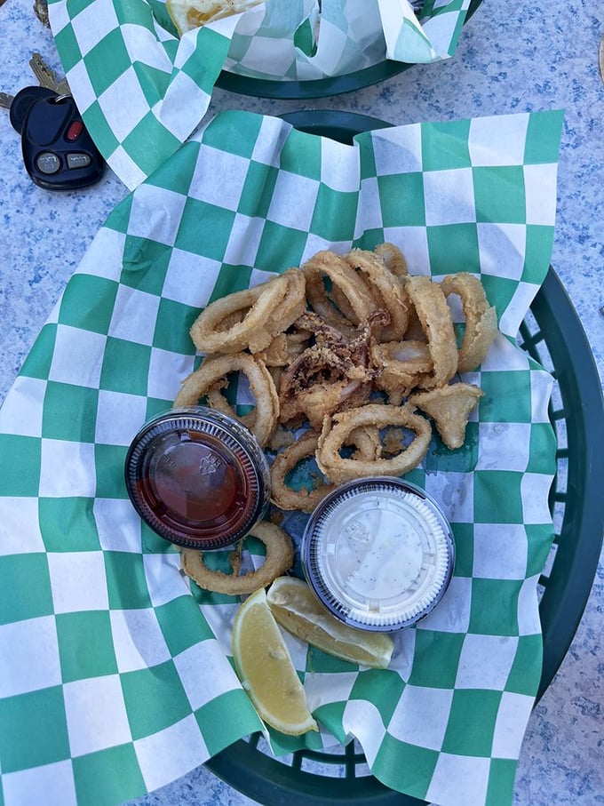 Calamari that's tender, not rubbery – the unicorn of seafood appetizers. Those dipping sauces aren't just condiments, they're supporting actors in a delicious drama.