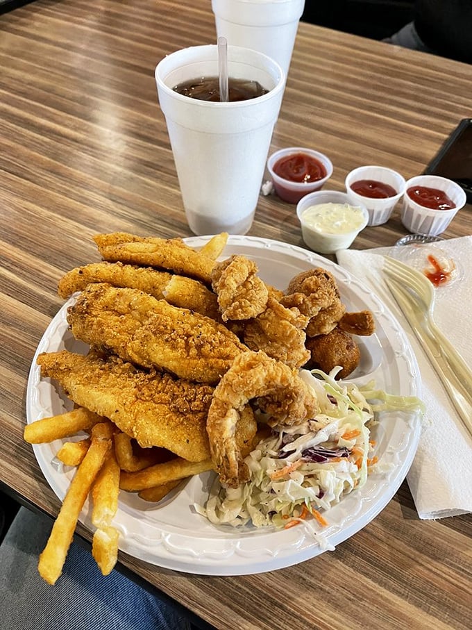 A seafood platter that would make coastal restaurants jealous – golden catfish and plump shrimp with the kind of crunch that echoes in your dreams.