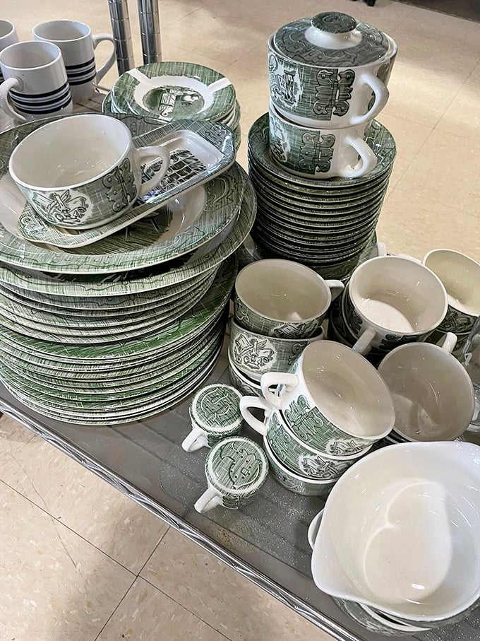 Fine china and everyday dishes mingle together, each piece holding memories of family meals.