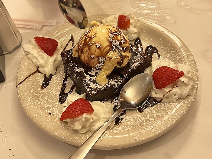 Chocolate cake crowned with ice cream and surrounded by whipped cream—because you can't spell dessert without the word "stress reliever."