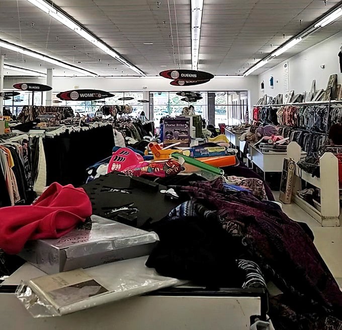 Color-coded clothing creates a rainbow road to bargains. The organization system here is surprisingly methodical—like a library where you can wear the books.
