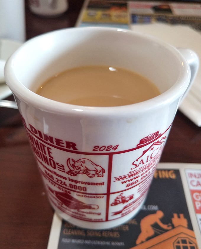 The humble diner coffee mug – steadfast companion to countless conversations, early mornings, and life-changing decisions made over bottomless refills.