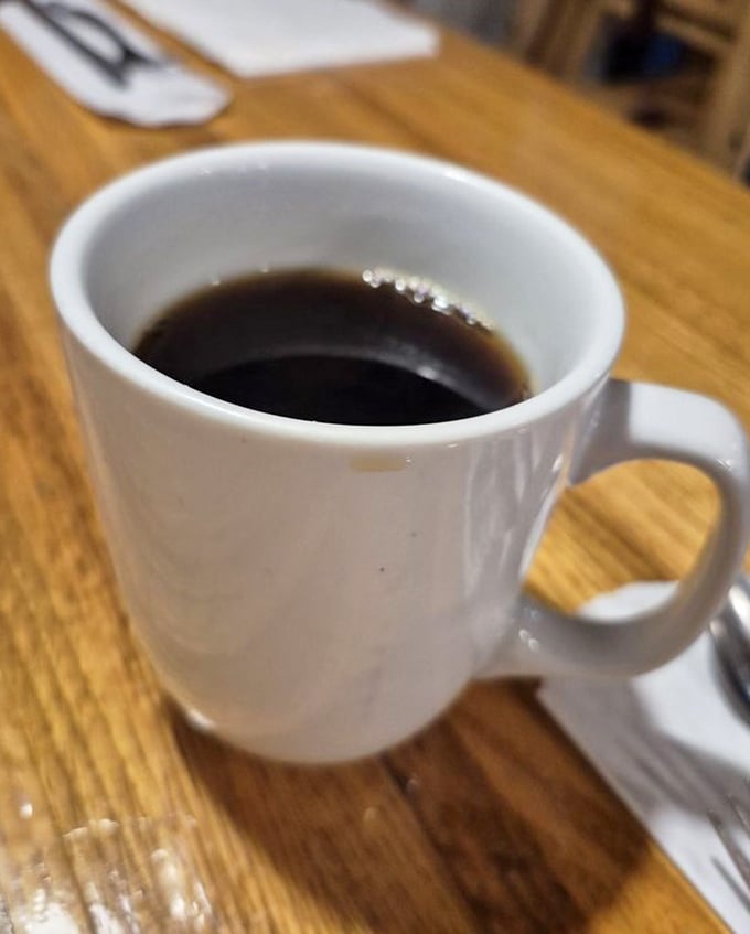 Simple pleasures: a sturdy white mug filled with coffee dark enough to jumpstart your heart. No fancy latte art needed when the brew is this good. 