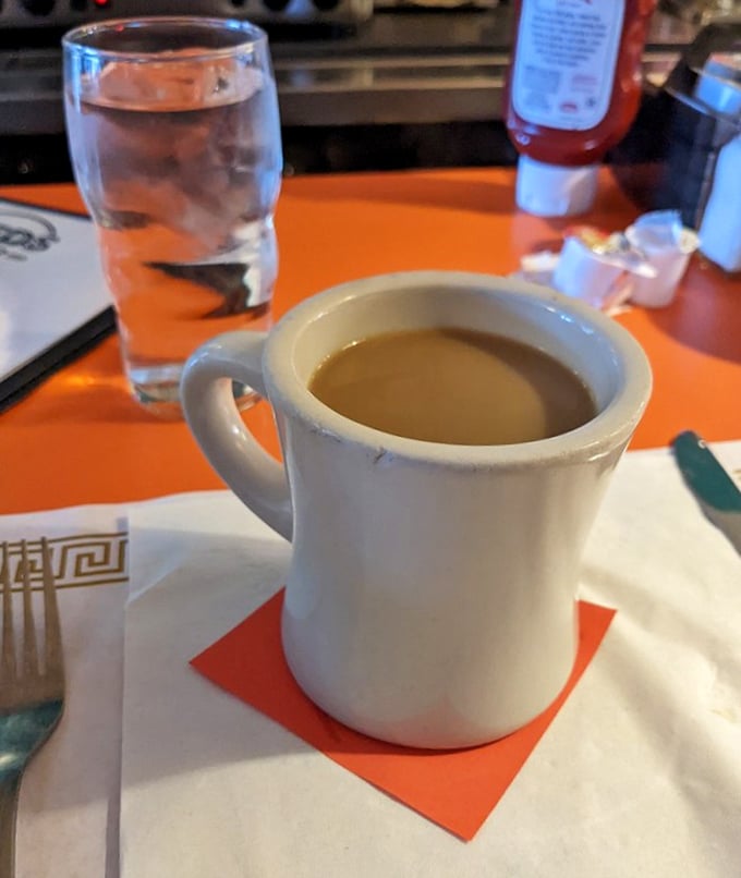 The coffee at Fred's comes in these sturdy white mugs that somehow make everything taste better—like drinking from the Holy Grail of diner culture.