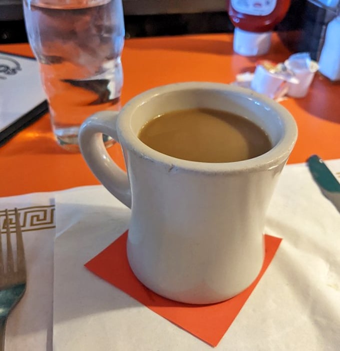 The classic diner mug cradles coffee like it's liquid gold – simple, sturdy, and promising to transform you from zombie to human with each sip.