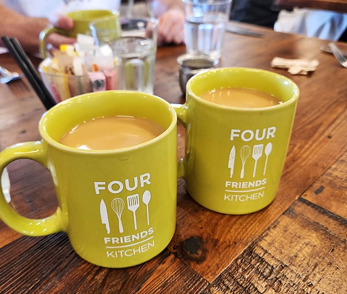 The cheerful yellow mugs aren't just containers—they're morning mood enhancers, filled with coffee robust enough to jumpstart even the most reluctant Monday.