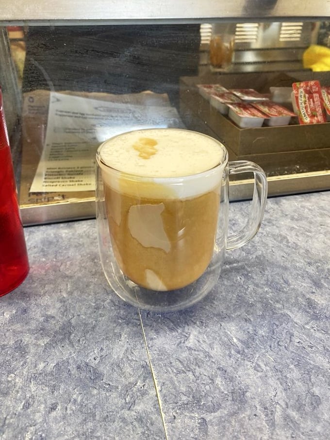 Mickey's coffee arrives in a double-walled glass mug, promising warmth and caffeine in equal measure—fuel for conversations that could last until dawn.