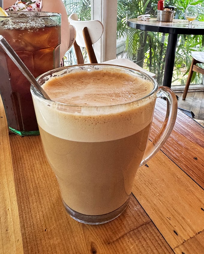 Coffee served in a glass mug large enough to swim in—because vacation mornings deserve more than just a standard cup of joe.