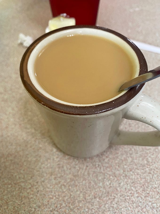 The humble diner coffee—reliable as a Midwest handshake, served in a mug that's seen more stories than a small-town barber shop.