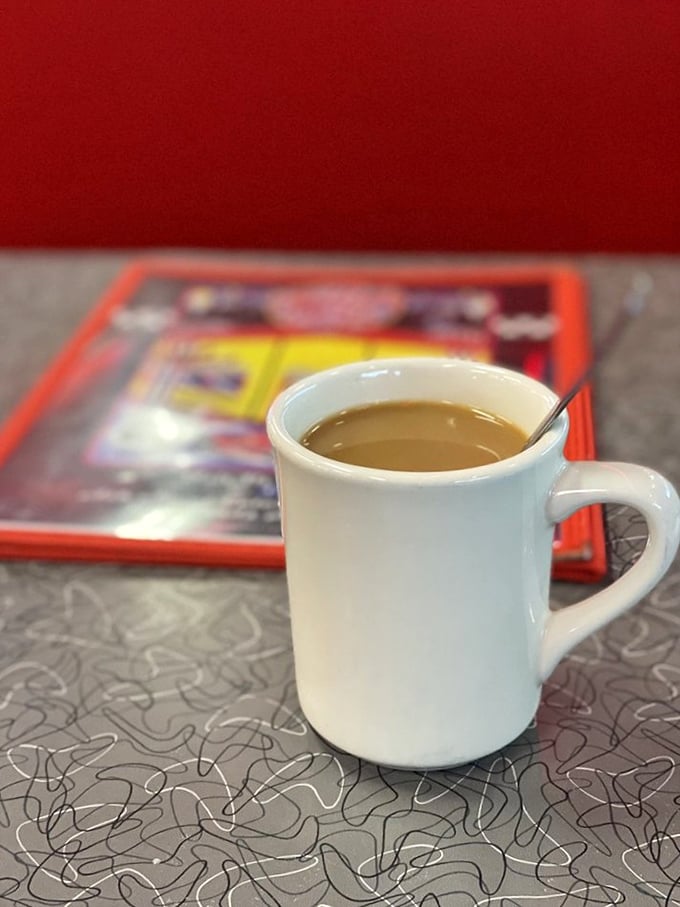 The humble diner coffee mug—holding the elixir that transforms zombies into humans since forever. Simple, reliable, essential.