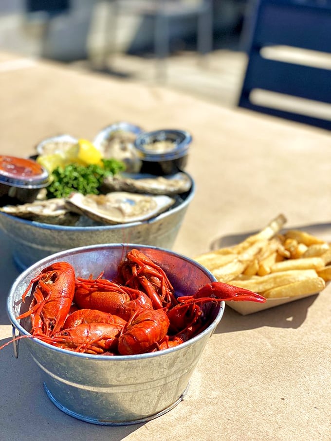 Crawfish in metal buckets—the Chesapeake's answer to Southern boils. These little red crustaceans demand you slow down and savor each sweet, tender morsel.