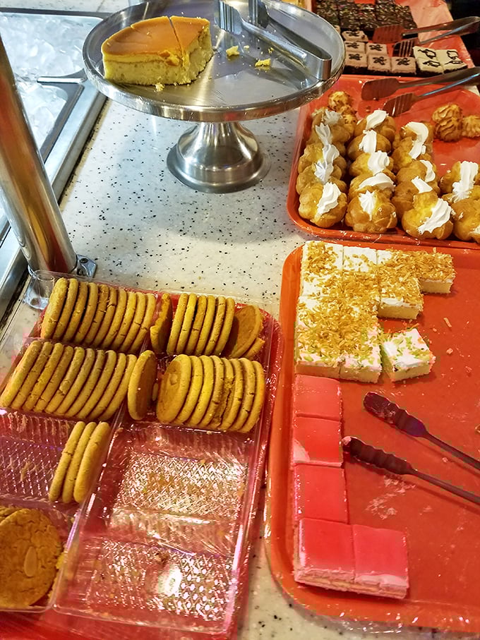The dessert station offers sweet finales from both East and West—cookies, cream puffs, and cake standing by for your inevitable surrender.
