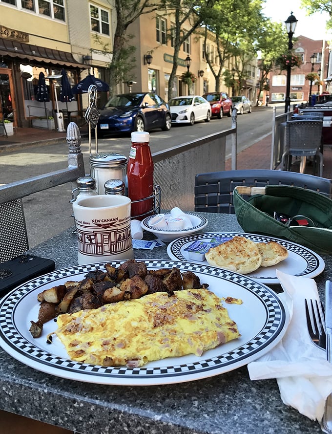 Breakfast with a view – where fluffy omelets meet home fries in perfect harmony while New Canaan's main street provides the morning entertainment.